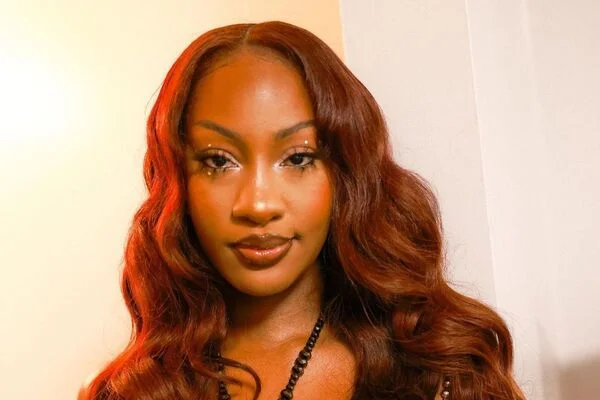 Viral Moment: Tems Connects with Fan on Stage at “Born in the Wild ...